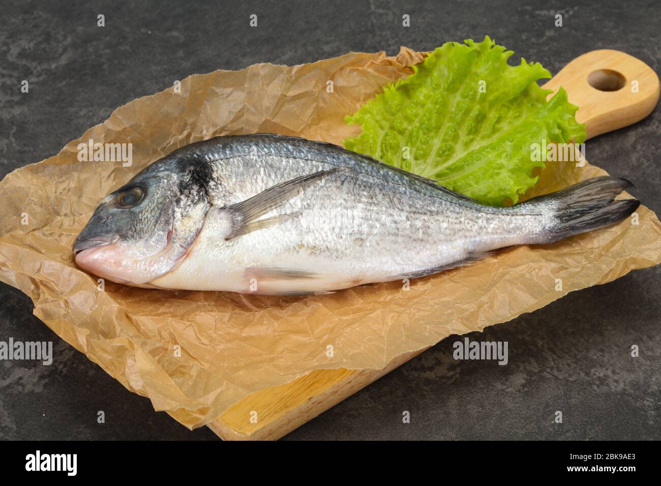 Raw Dorada fish ready for cooking Stock Photo - Alamy