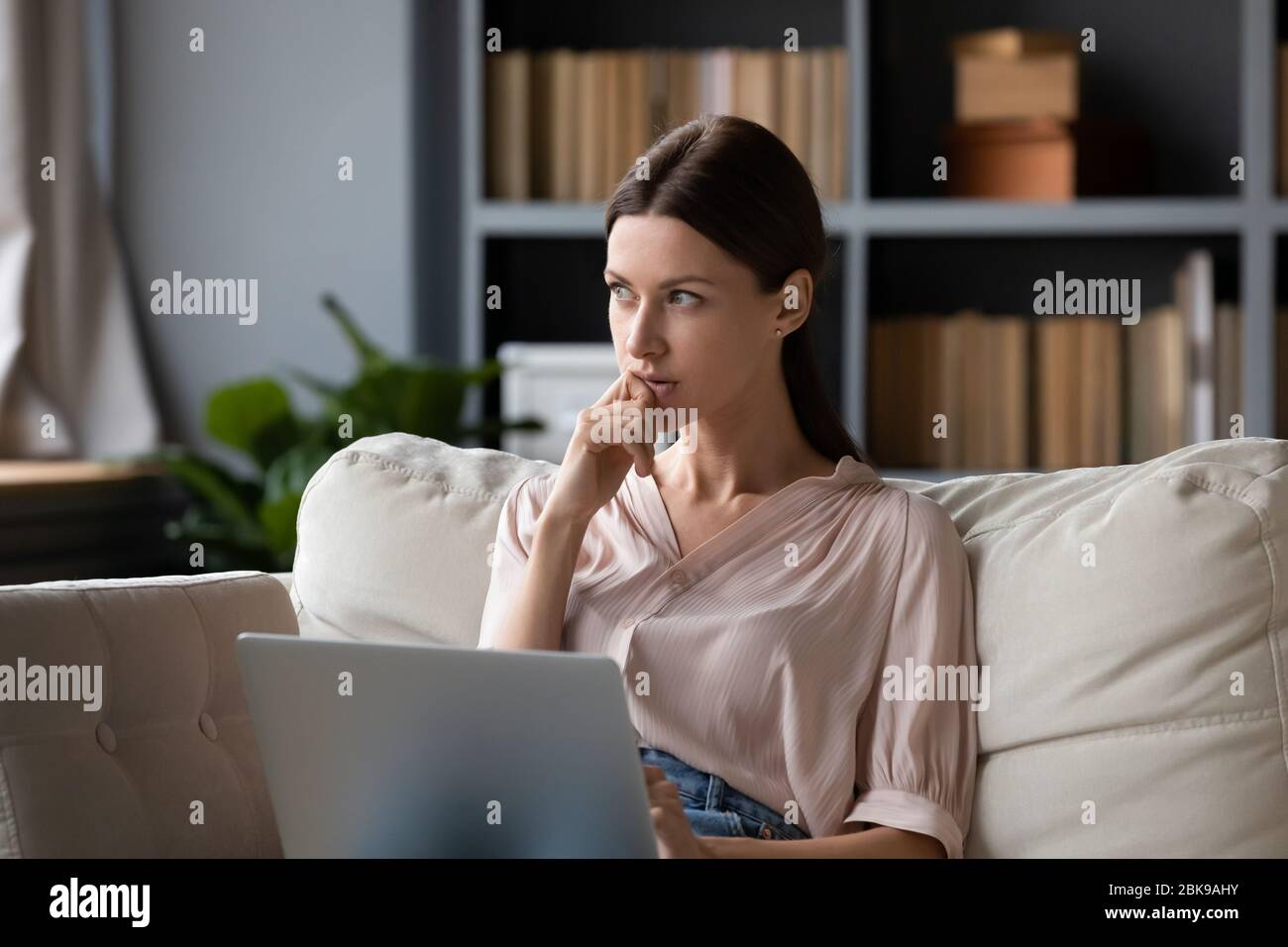 Person sitting home pondering solution hi-res stock photography and ...