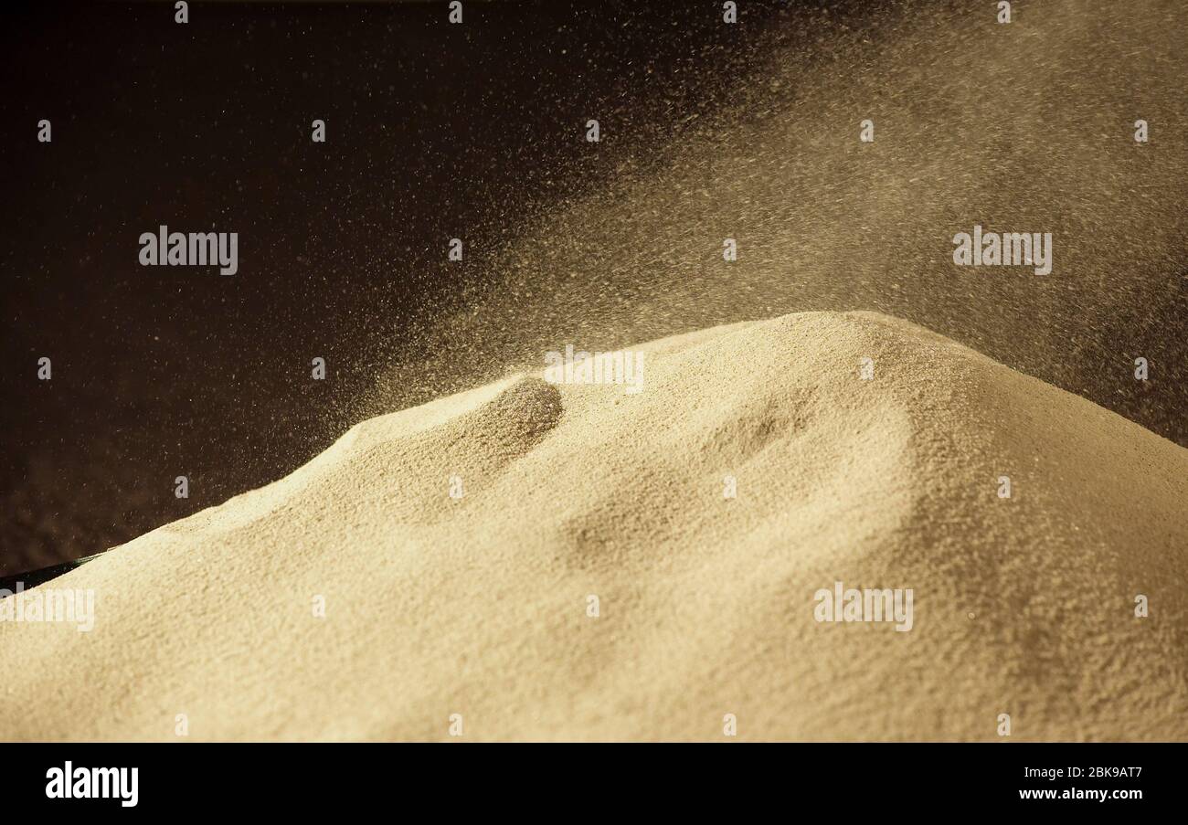 Wind blowing over sand dune Stock Photo - Alamy