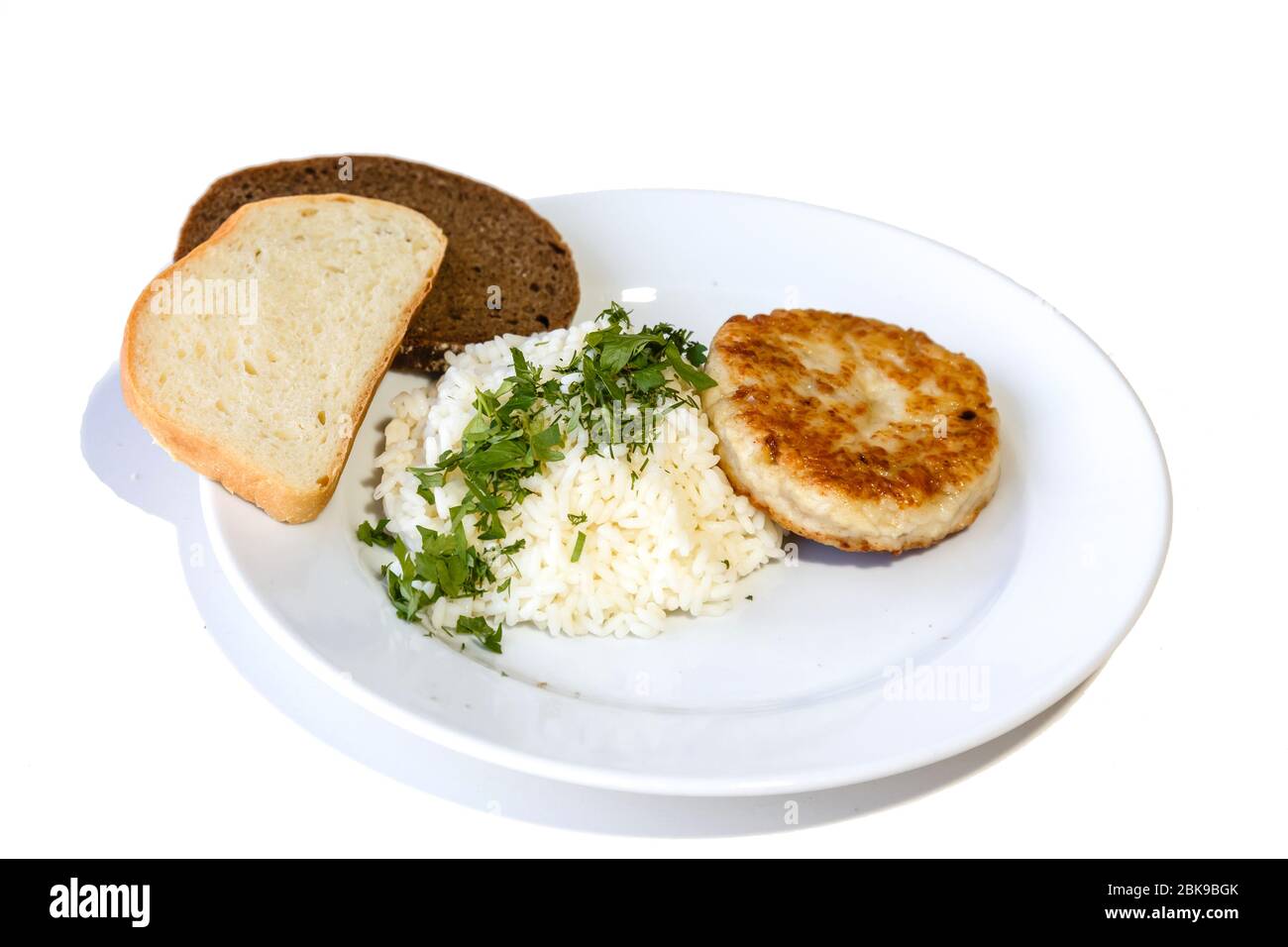 Cutlet with rice and bread isolated on white background Stock Photo - Alamy