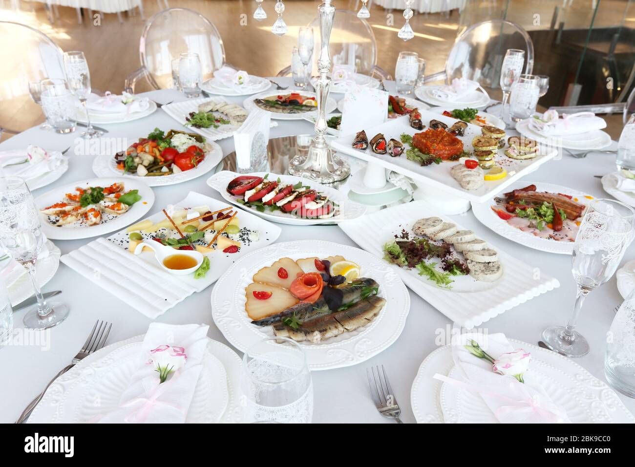 Served banquet table with dishes in restaurant Stock Photo - Alamy