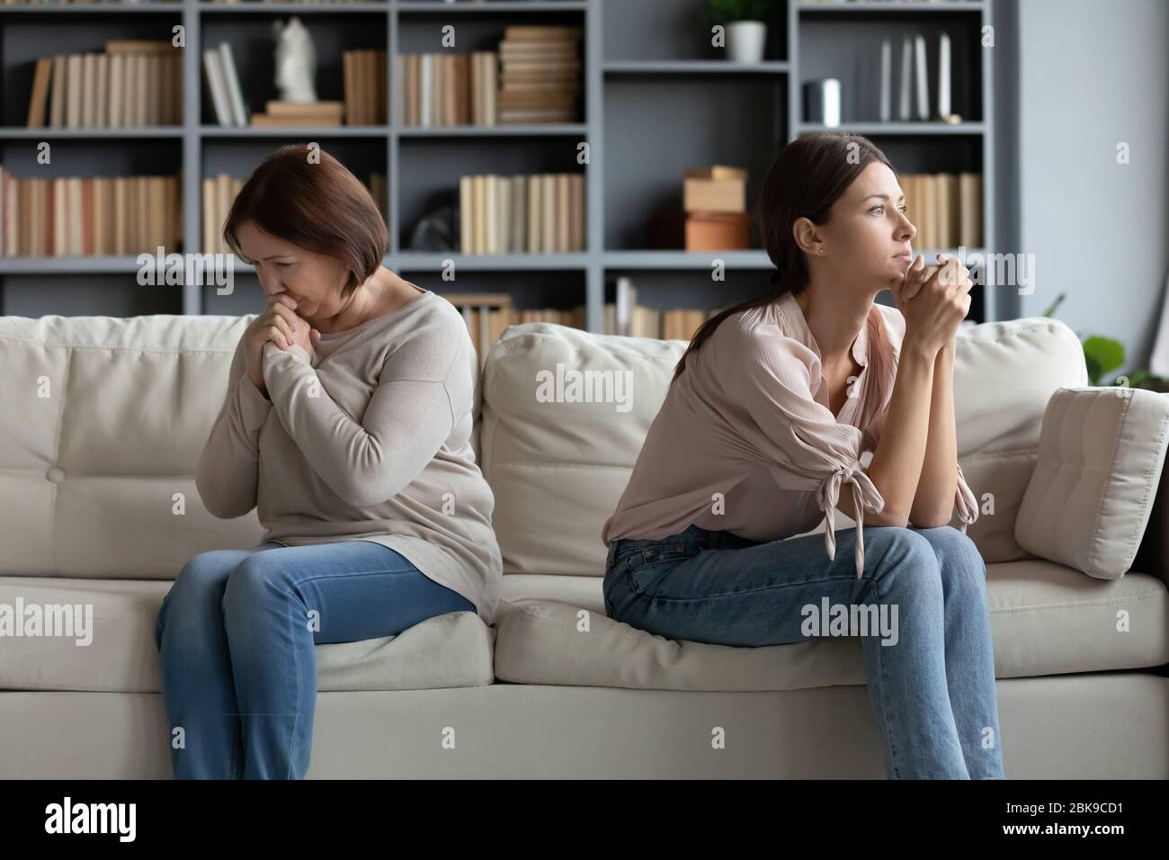 Stubborn adult daughter and mature mother ignoring each other Stock ...