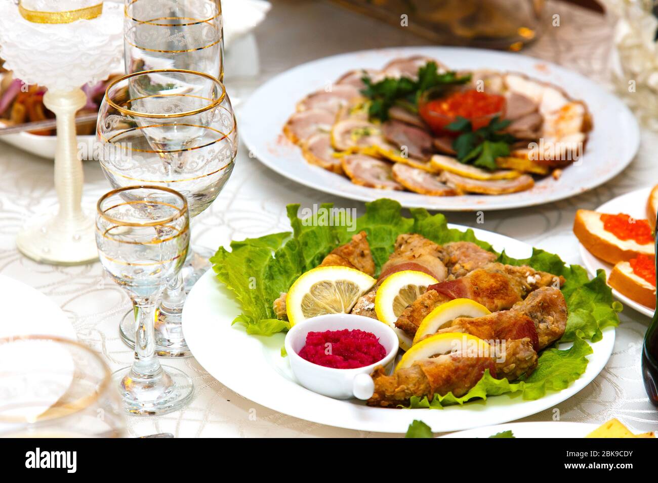 Meat and fish cutting on banquet table Stock Photo - Alamy