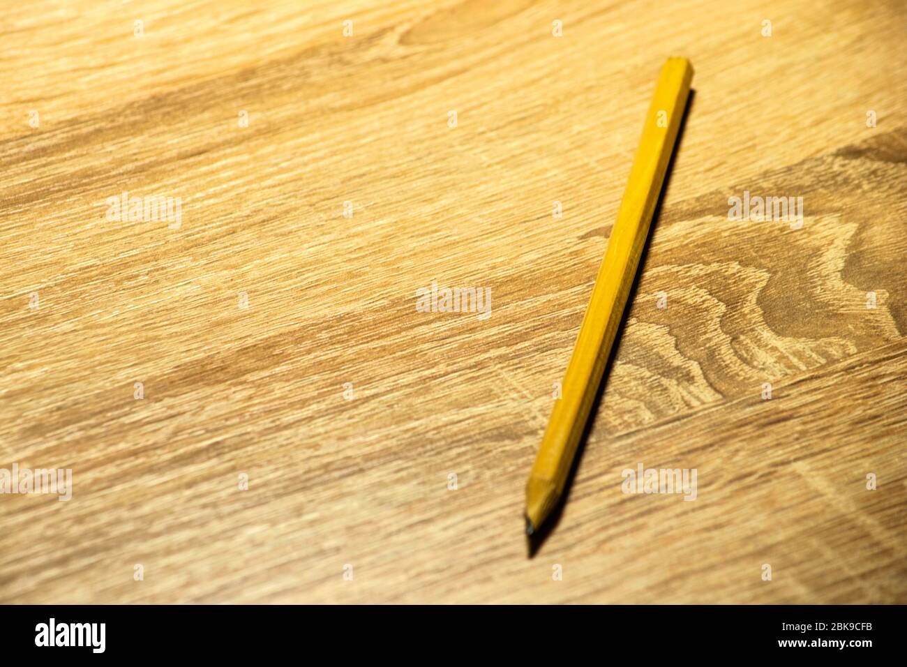 one pencil for drawing lie on a wooden table Stock Photo - Alamy