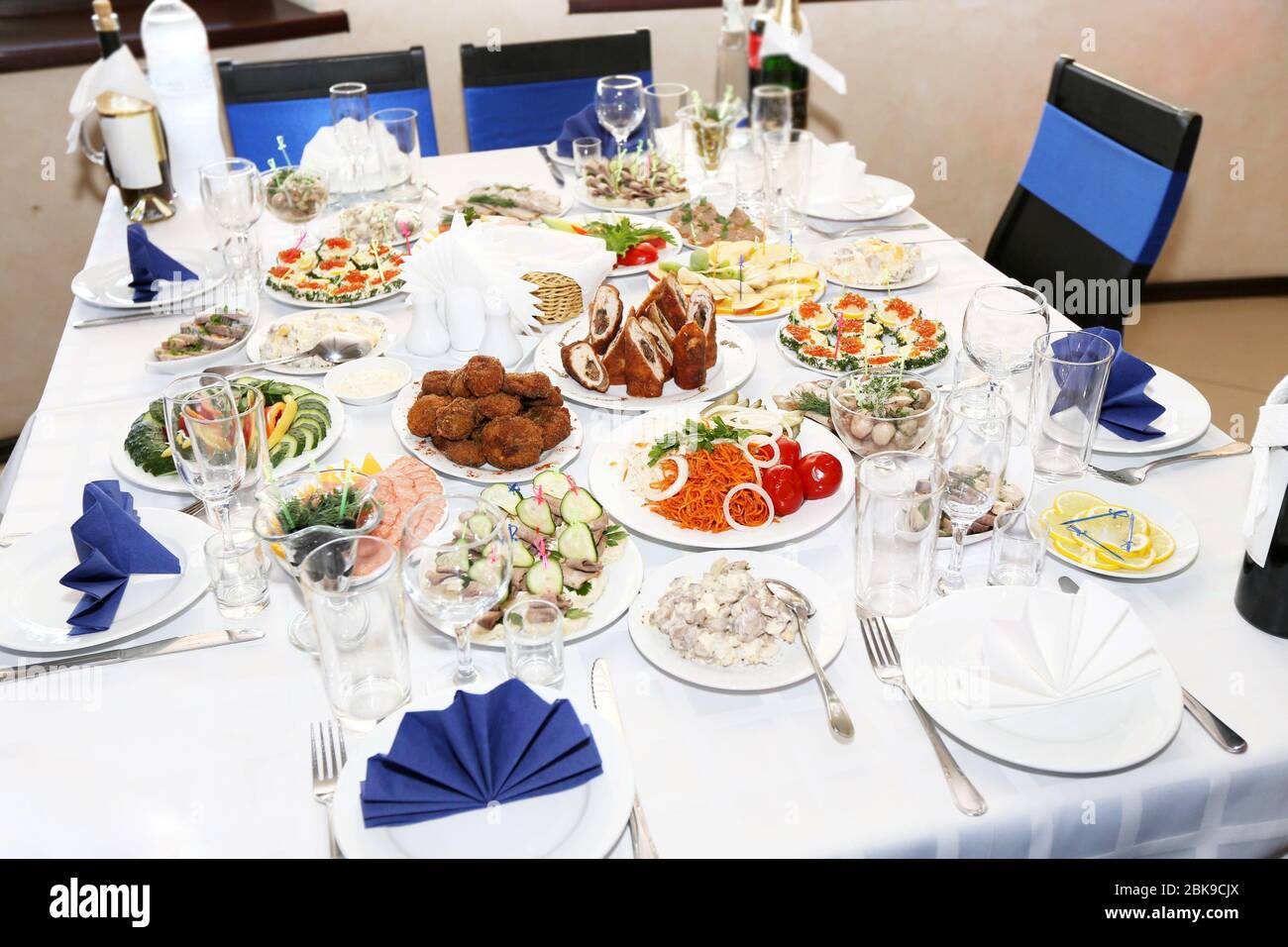 Served banquet table with dishes in restaurant Stock Photo - Alamy