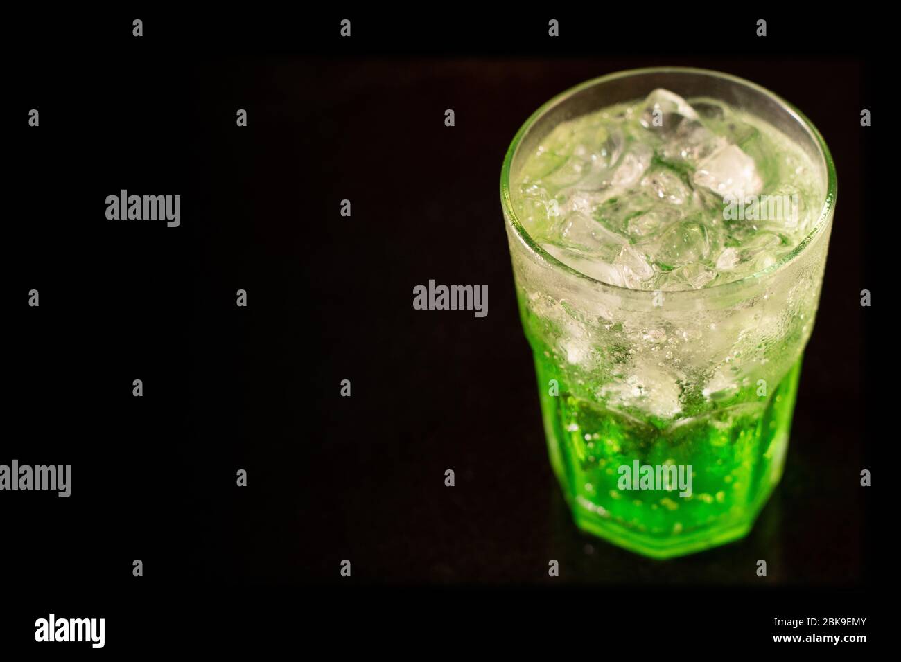 green alcholol cocktail isolated on black background Stock Photo - Alamy