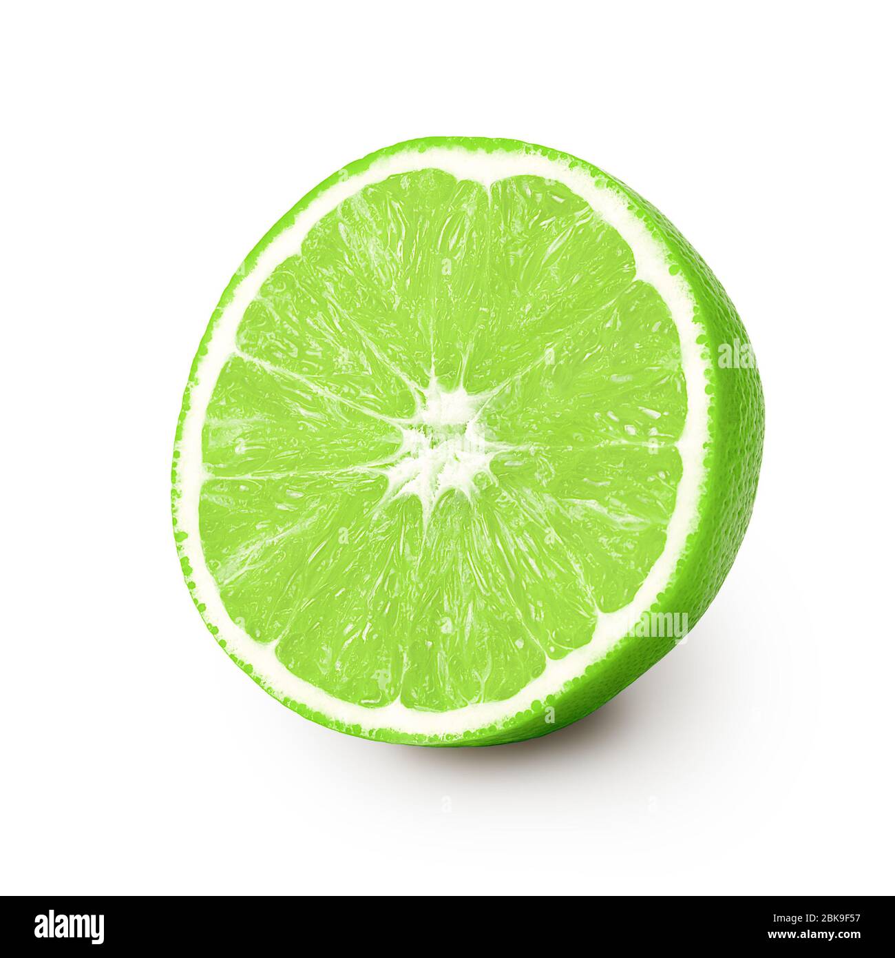 Isolated lime. One half ripe lime isolated on a white background ...