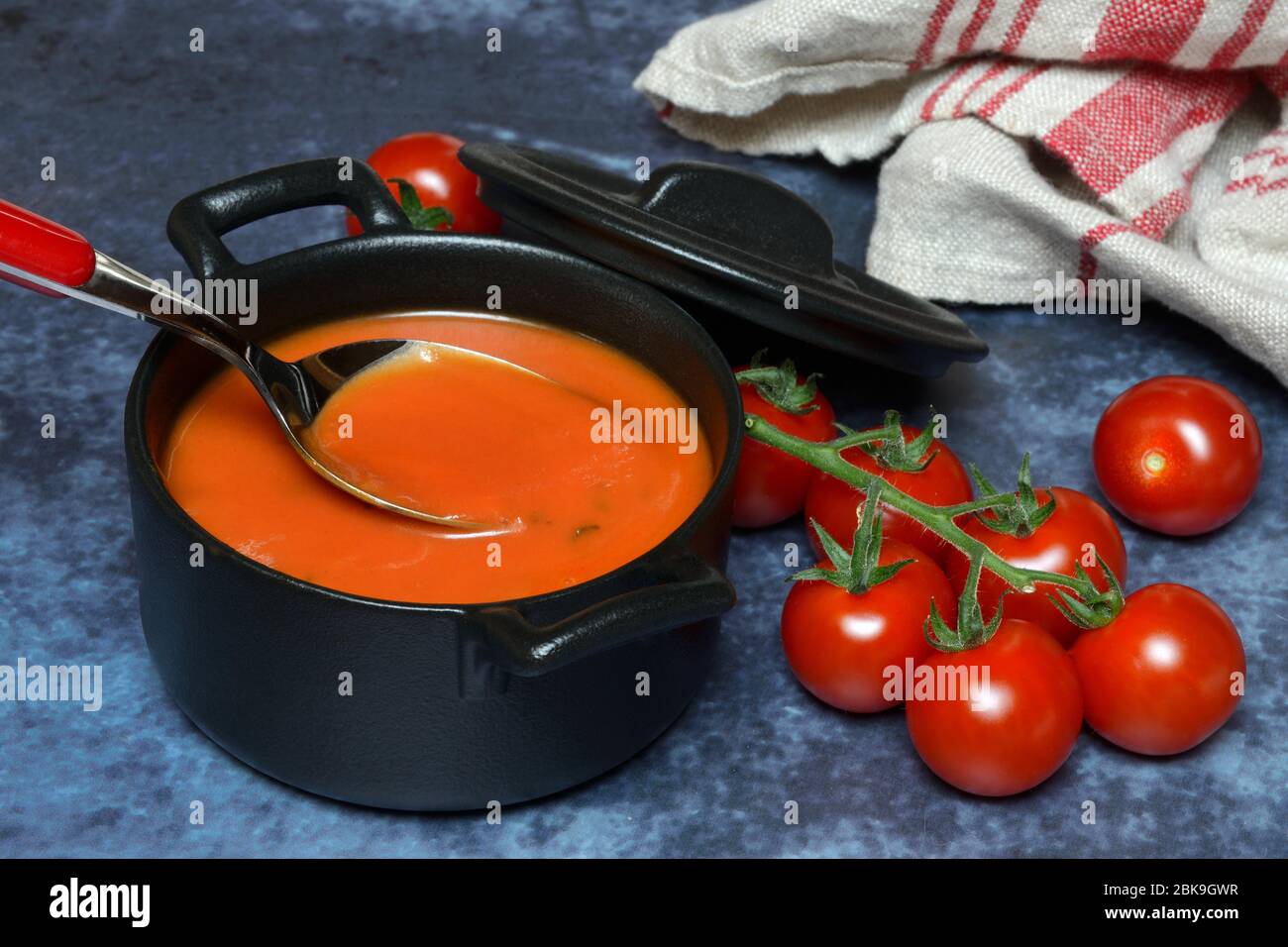Tomato soup in pot with tablespoon hi-res stock photography and images ...