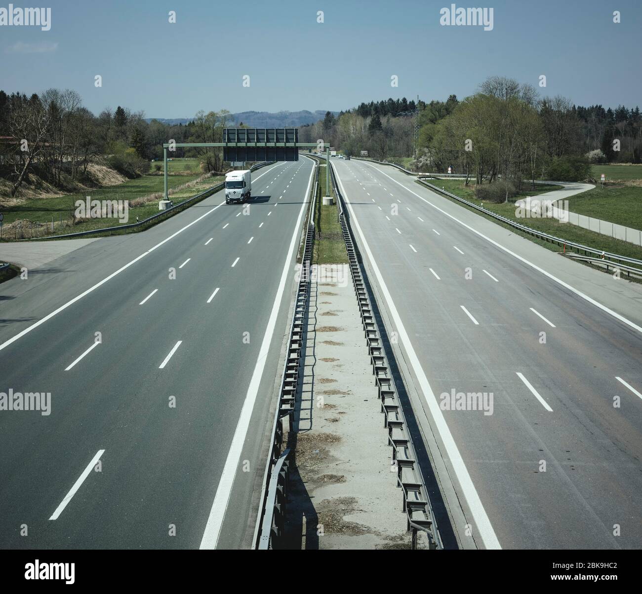 View of the almost empty A8 motorway from the motorway bridge near ...
