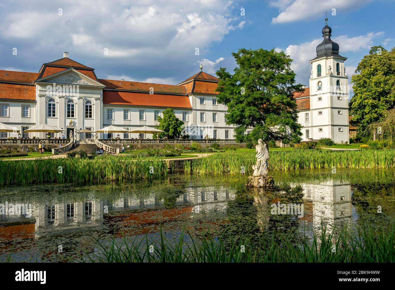 South facade with castle tower at the pond in the castle garden ...