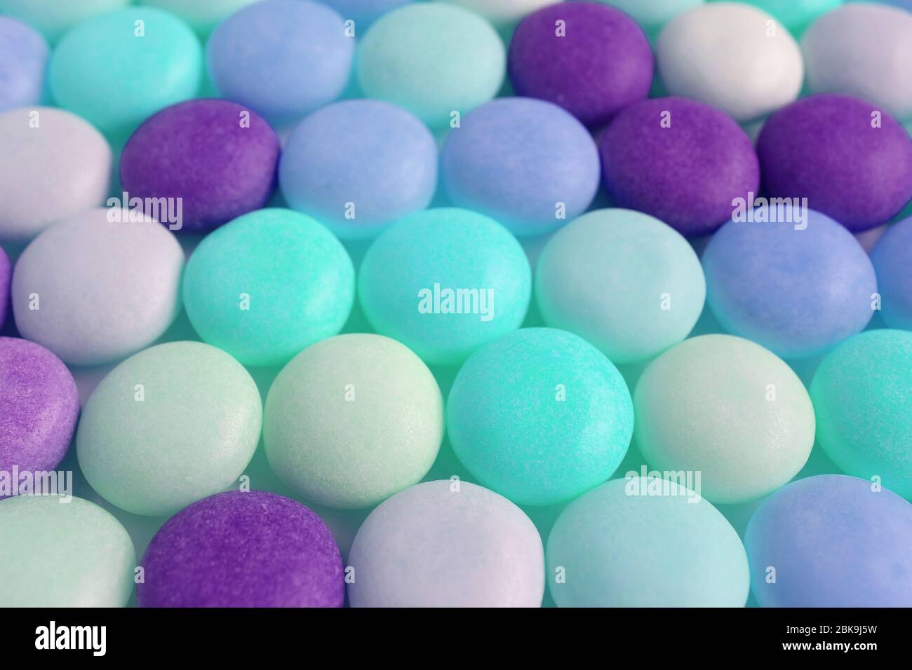 Row of Aqua Blue and Purple Color Tone Round Shaped Candies for ...