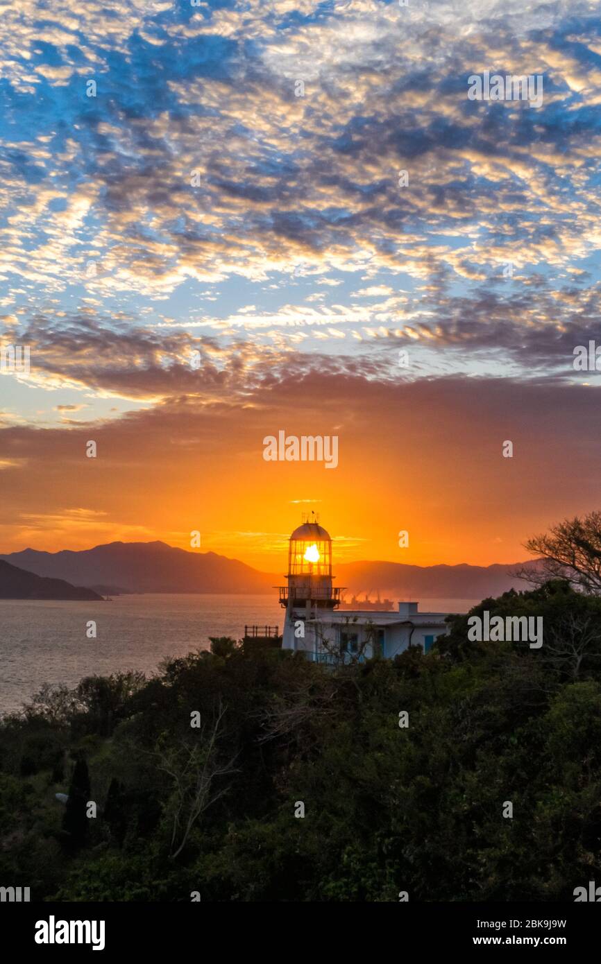 Lighthouse of Victoria Harbour at dusk Stock Photo - Alamy