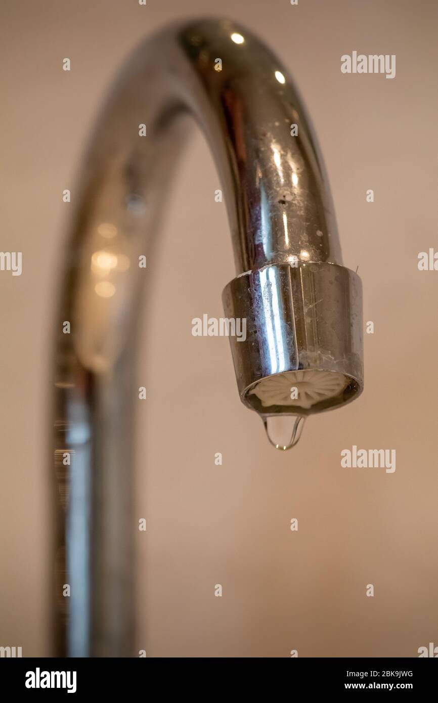Dripping chrome tap letting water leak out Stock Photo - Alamy