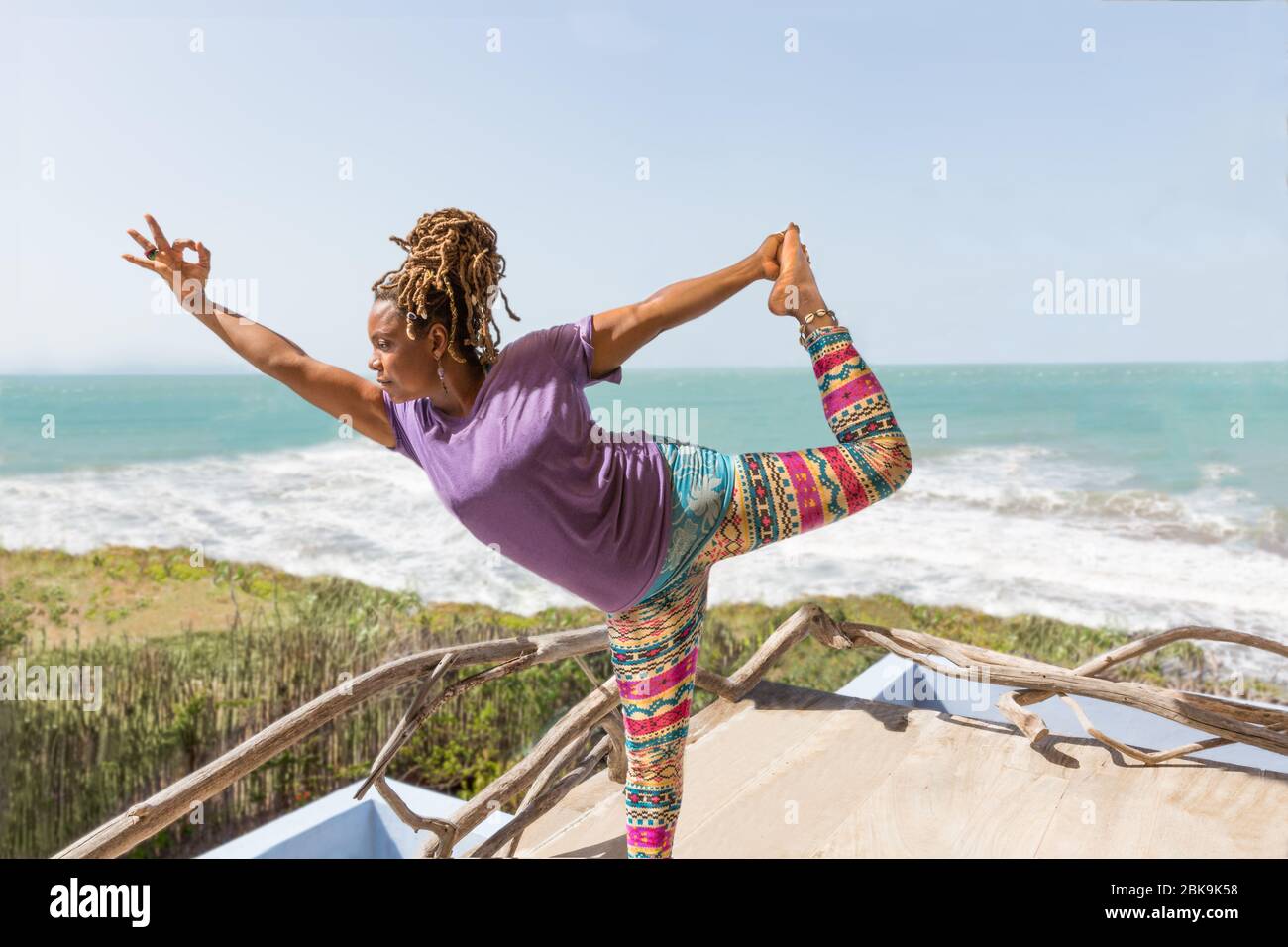 Beautiful Black, African, or Carribean woman practicing wellness and ...