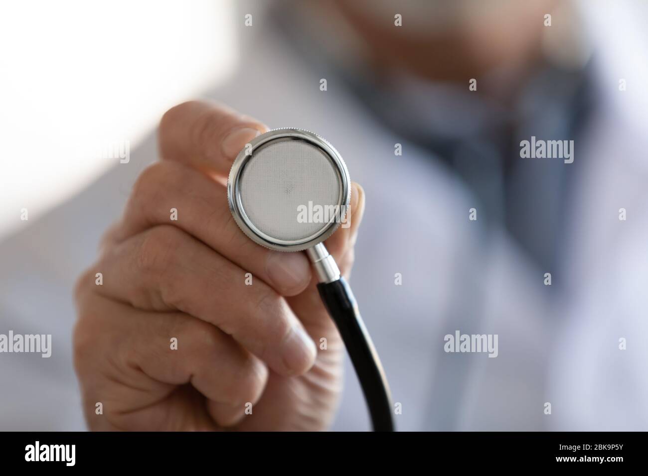 Old doctor hand holding medical stethoscope, close up view Stock Photo ...