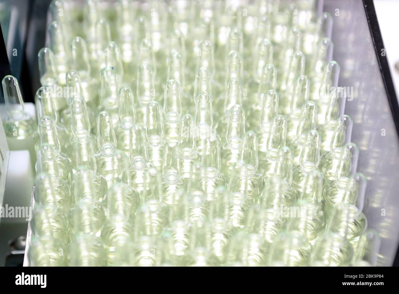Scientist holds a chemical sample bottle. Doctor hand in medical glove ...