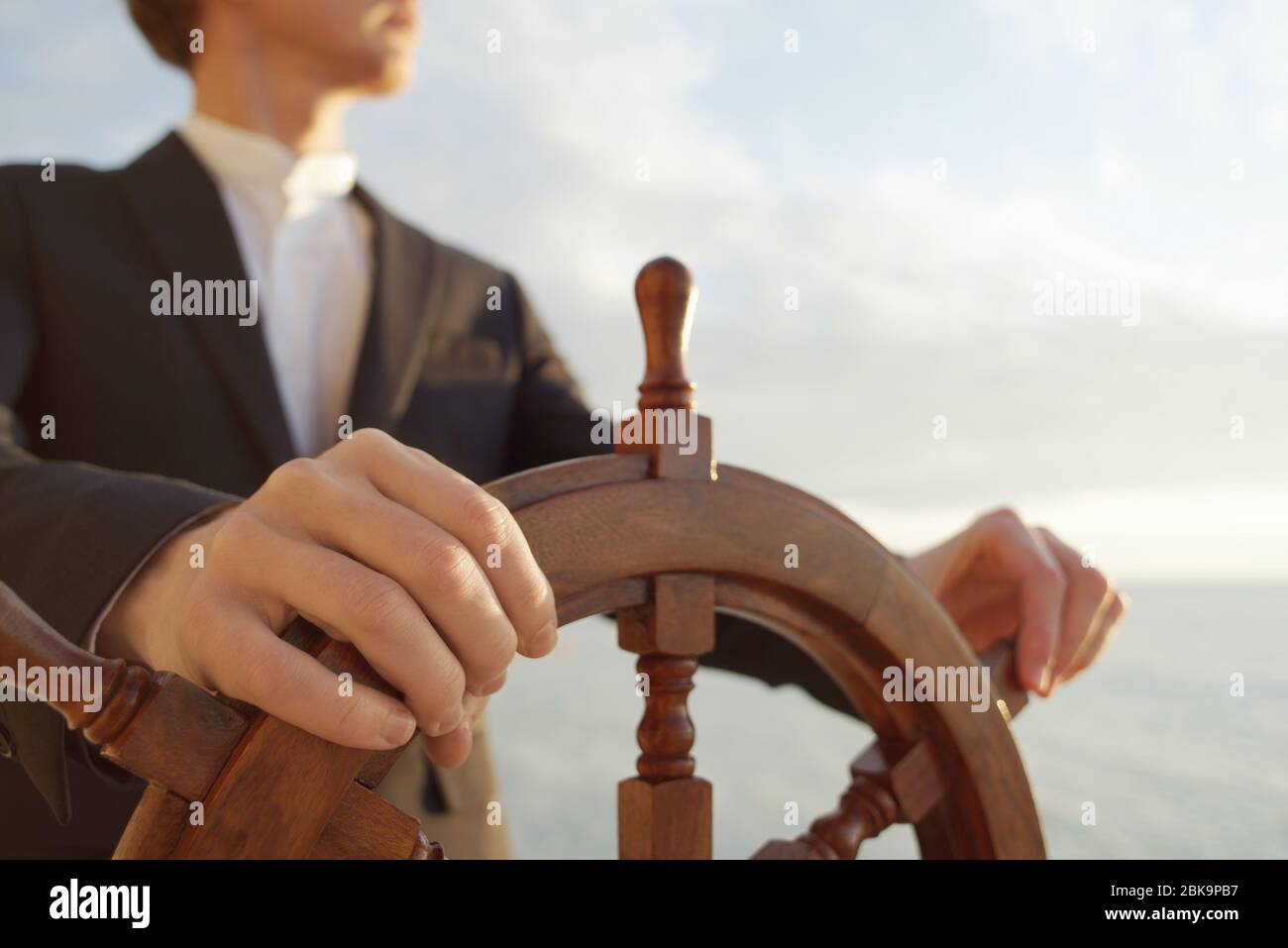 Hand on ship rudder Stock Photo - Alamy