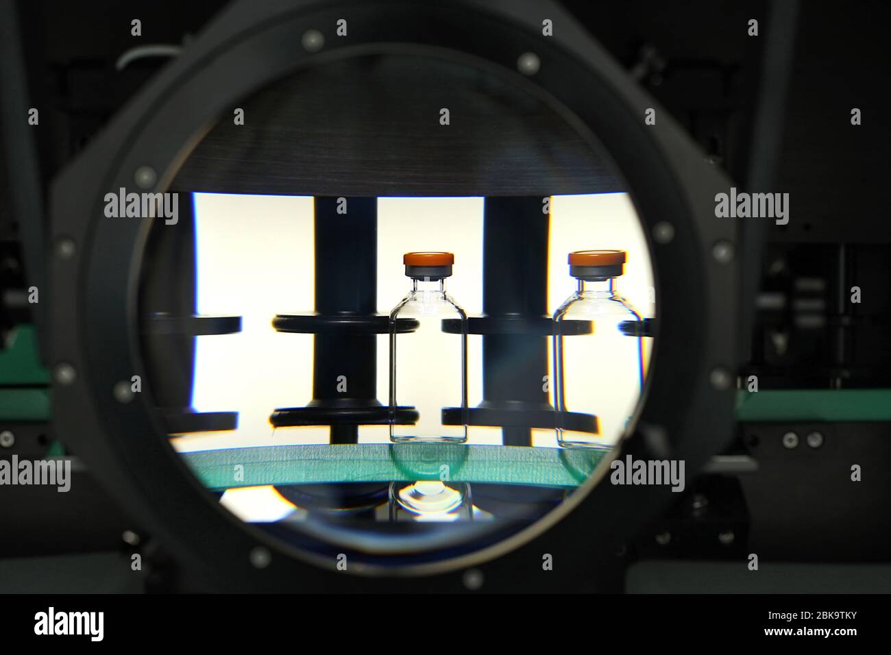 Quality Control vials for injection. Individual checks vial under a ...