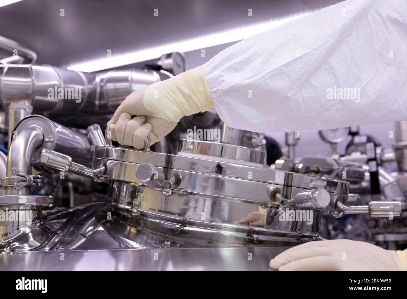 A huge rector for the production of medicine. The man closes the ...