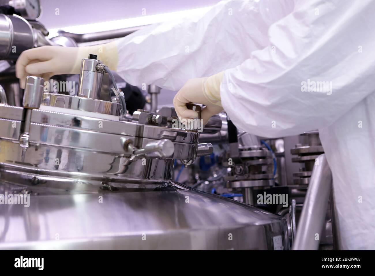 A huge rector for the production of medicine. The man closes the ...