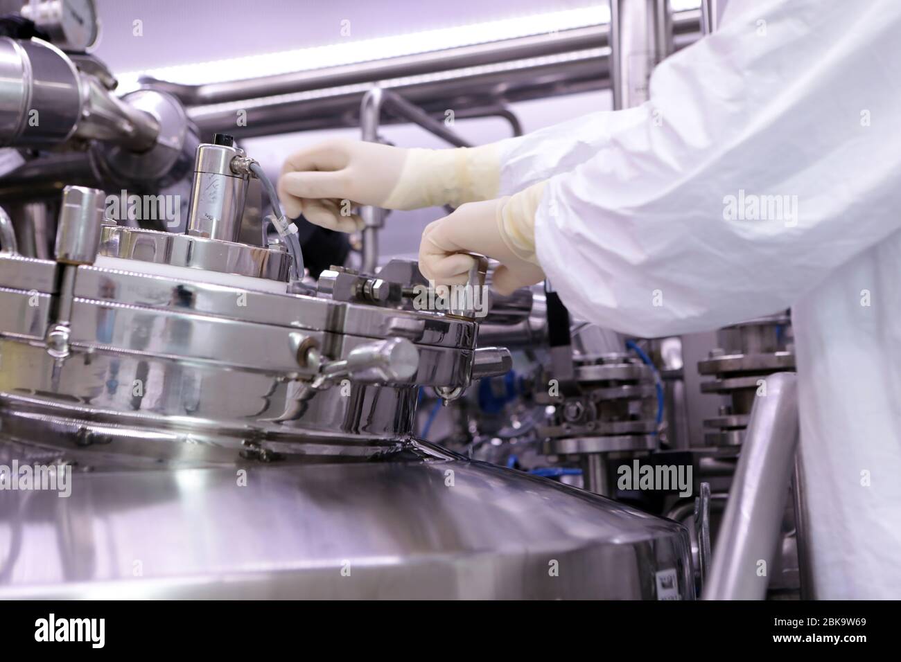 A huge rector for the production of medicine. The man closes the ...