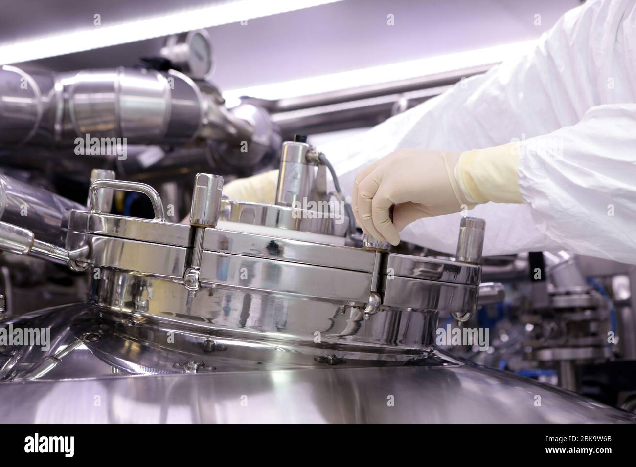 A huge rector for the production of medicine. The man closes the ...