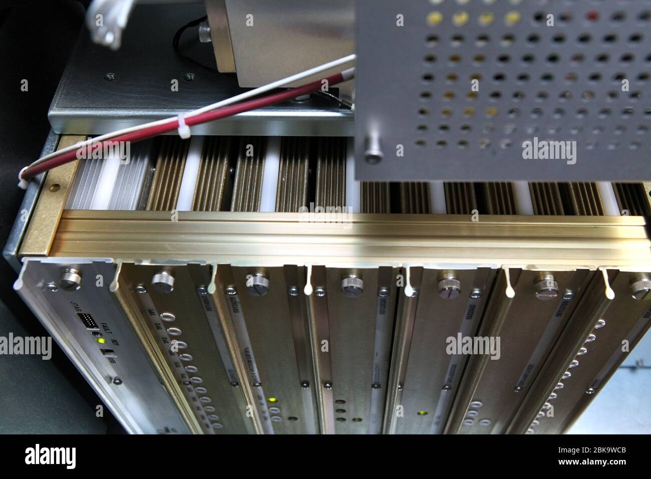 Adjust the mass spectrometer. The man analyzes the device for ...