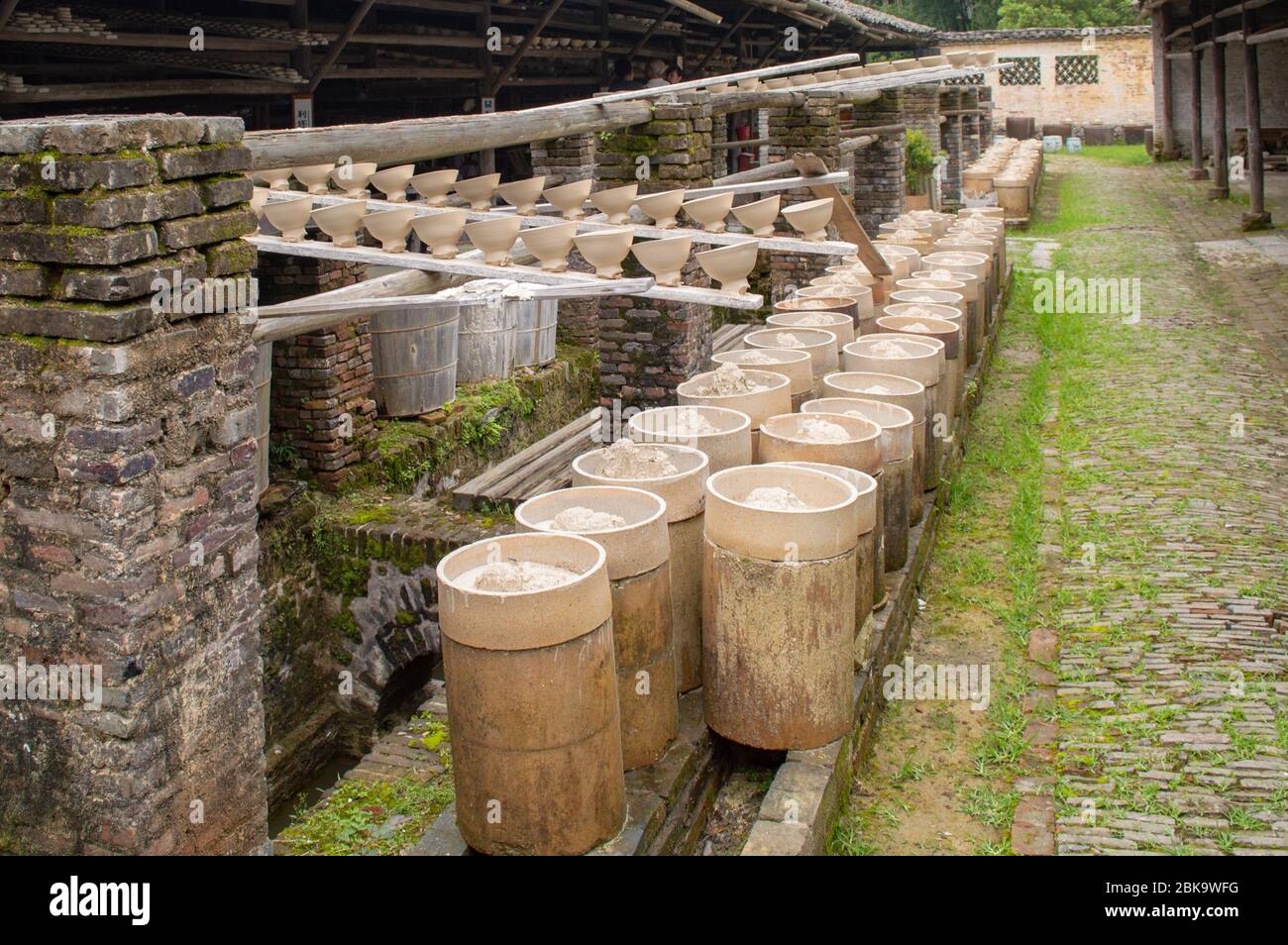 Fresh made clay pottery drying in old traditional pottery workshop in ...