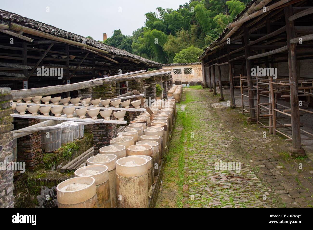 Fresh made clay pottery drying in old traditional pottery workshop in ...