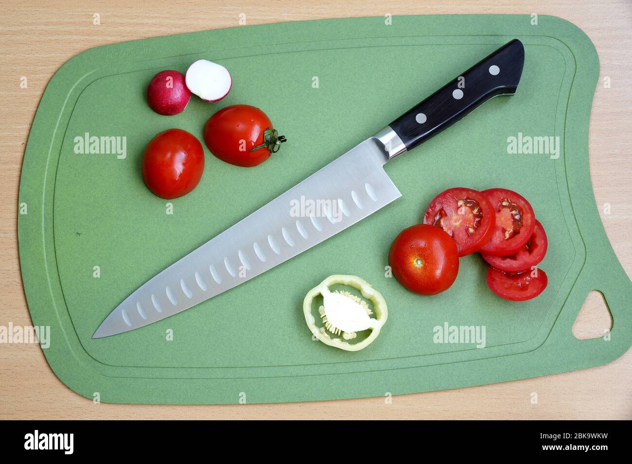Knife cook universal with a big blade on a chopping board Stock Photo ...