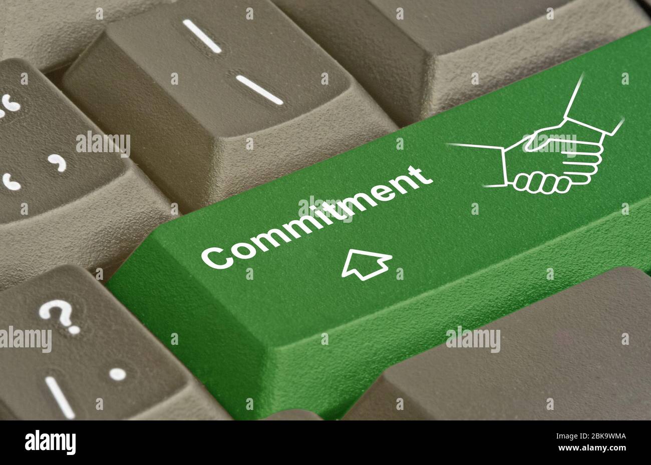 keyboard with key for commitment Stock Photo - Alamy
