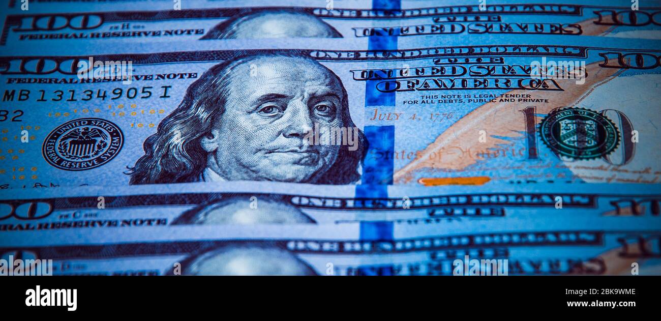 The background of a one hundred dollar bill. Style blue light Stock ...