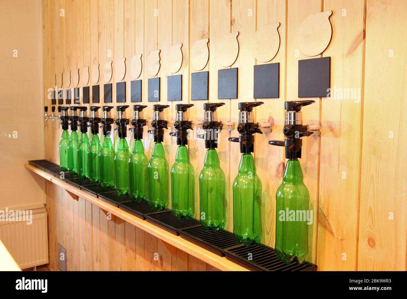 Large simultaneous spilling beer in the bar. The bar of wood. Wooden ...