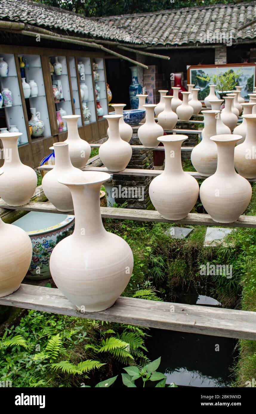 Fresh made clay pottery drying in old traditional pottery workshop in ...