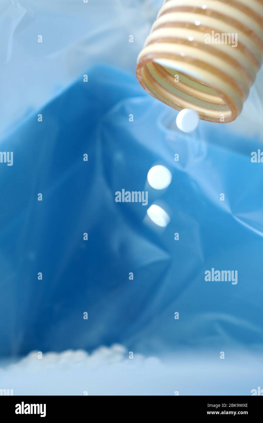 Production of tablets. Tablets poured into sterile packaging. Many ...