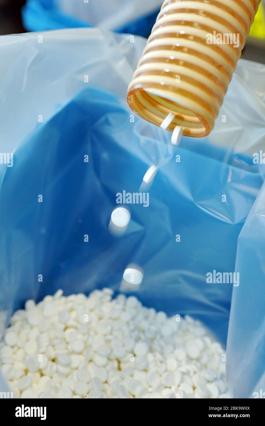 Production of tablets. Tablets poured into sterile packaging. Many ...
