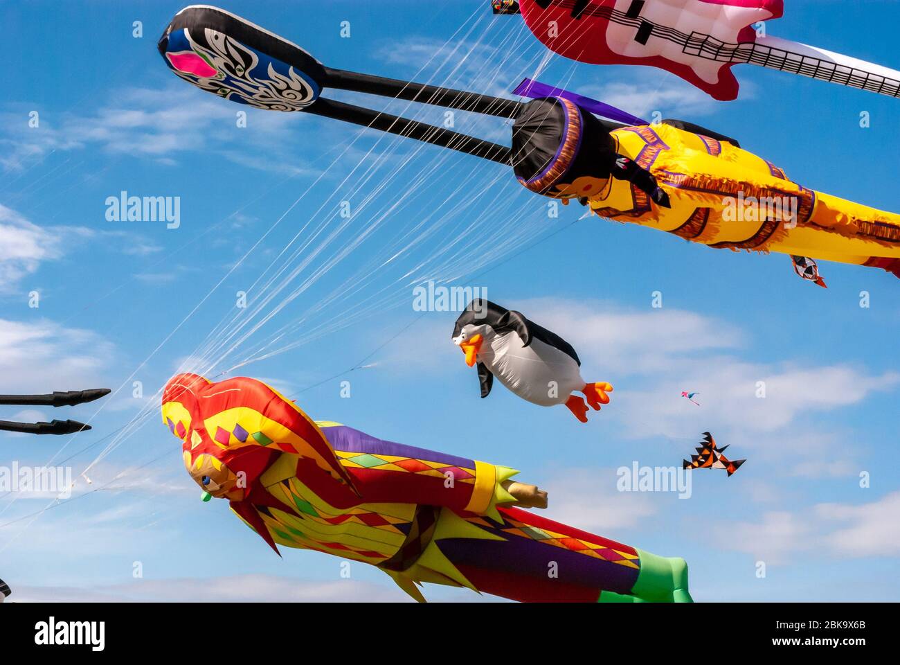 Giant, colorful flying kites fill the blue Summer sky at the Southsea ...