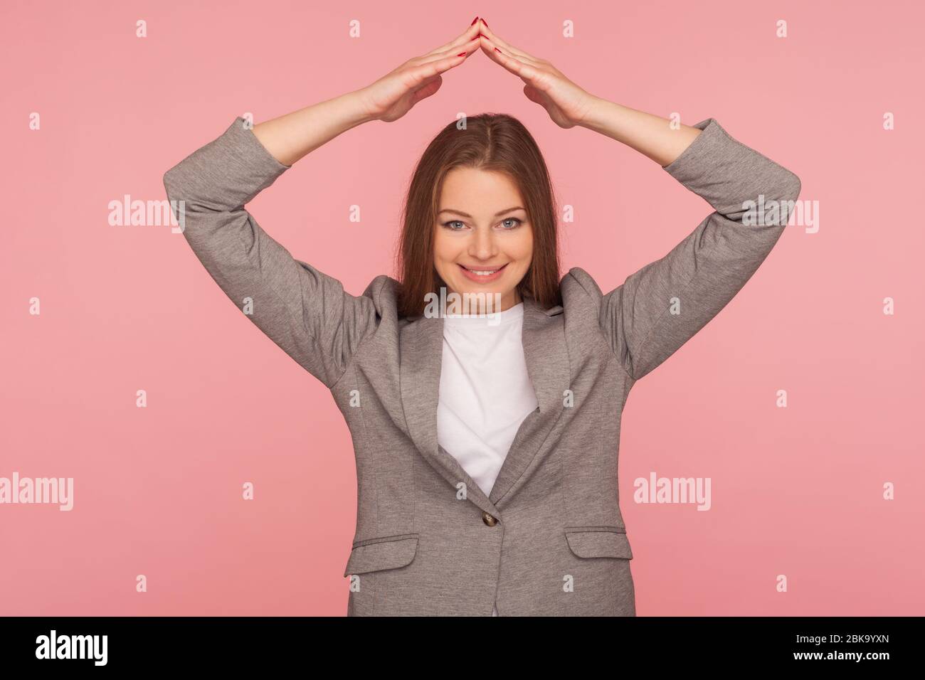 Life insurance policy. Portrait of happy young woman in business suit ...