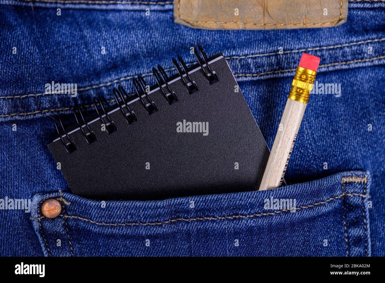 Notepad and pencil in pocket Stock Photo - Alamy