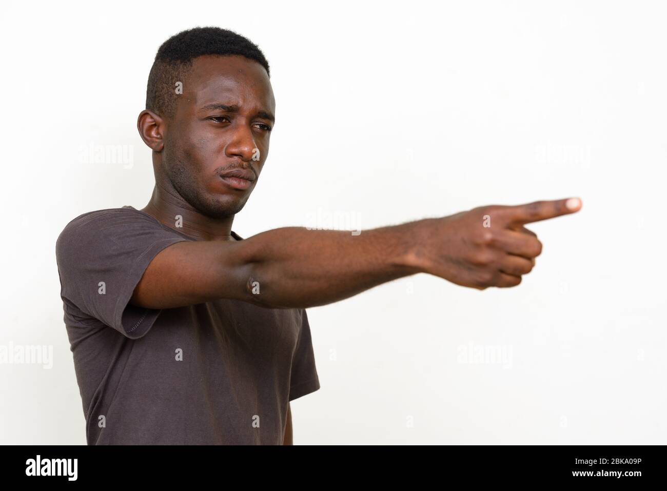 Portrait of stressed young African man pointing finger Stock Photo - Alamy
