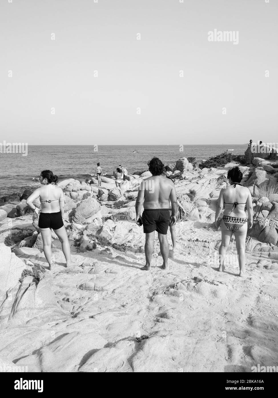 Sardinia, Italy - August 7, 2019: Tourists and bathers on the sand and ...