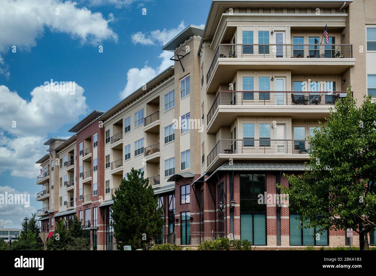 Brick and Plaster Condos with Balconies Stock Photo - Alamy