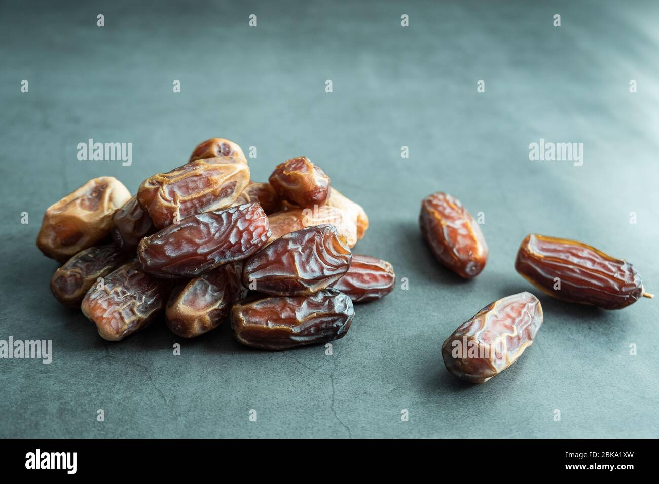 Raw date fruit ready to eat on concrete background. Traditional ...