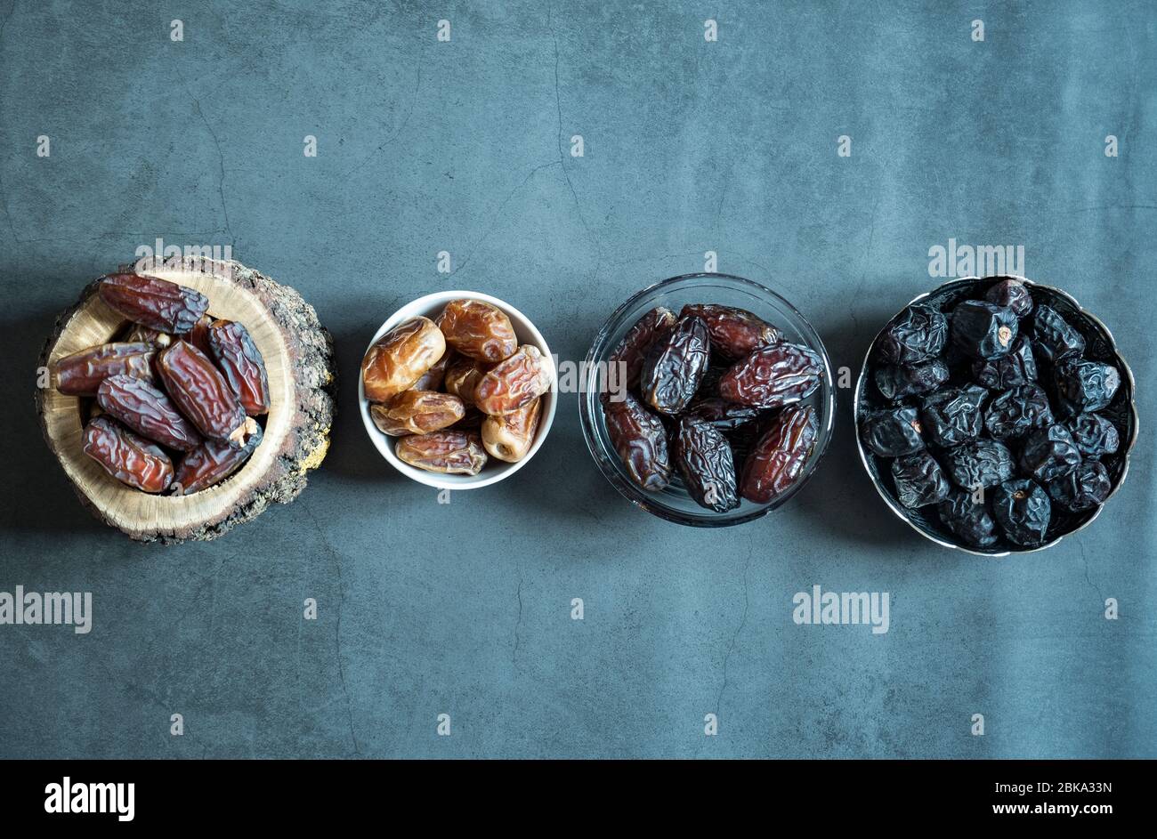 Different kind of raw date fruit ready to eat on concrete background ...