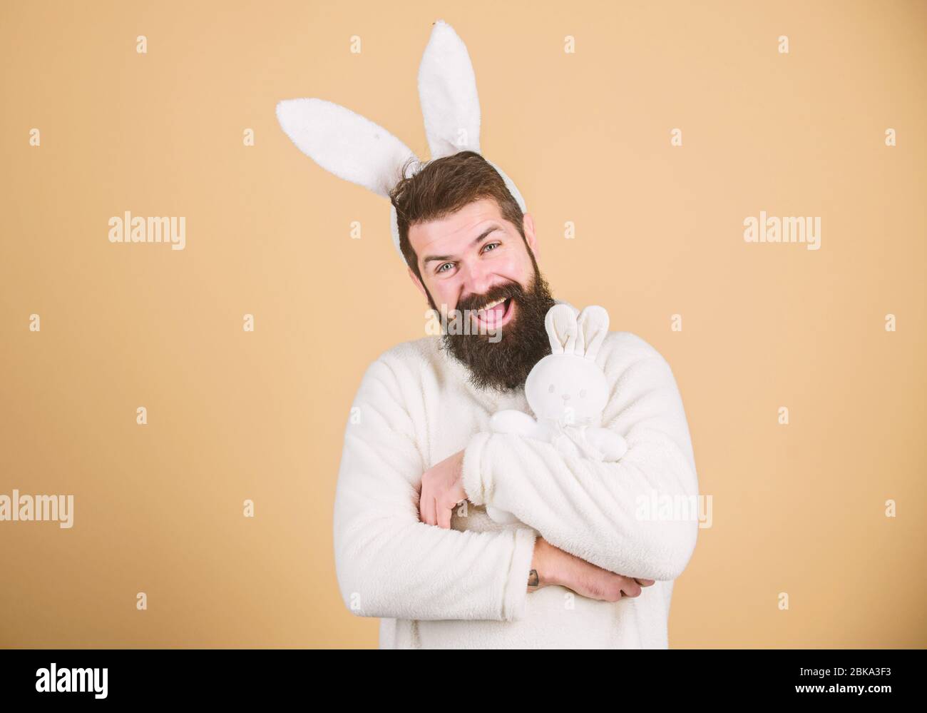 A furry face of Easter. Fertility and new life. Happy hipster with long ...