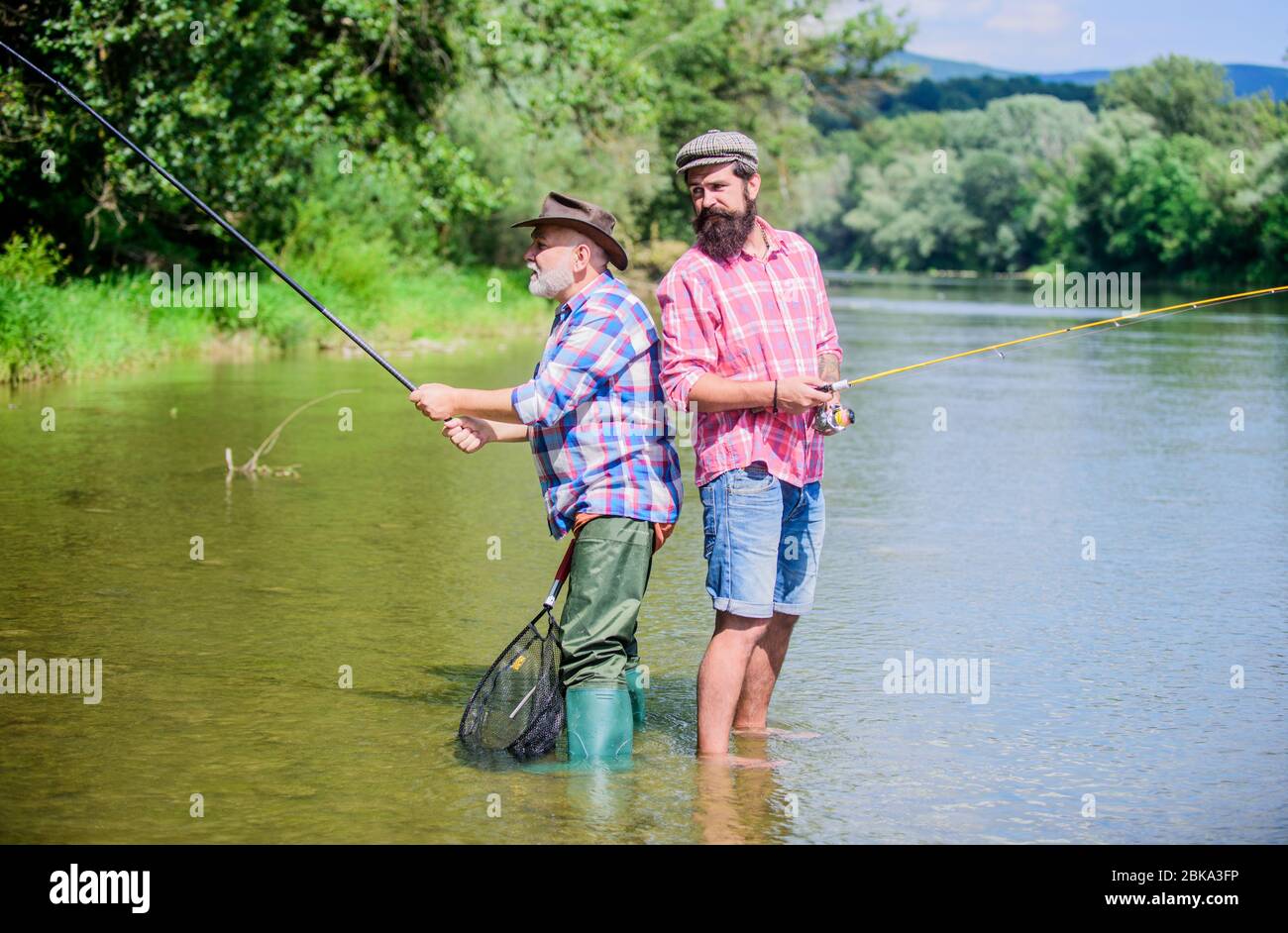 Fisherman fishing equipment. Fisherman grandpa and mature man friends ...