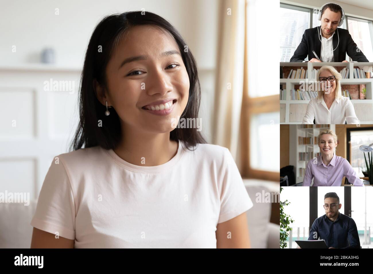 Smiling Asian employee talk on video call with colleagues Stock Photo ...