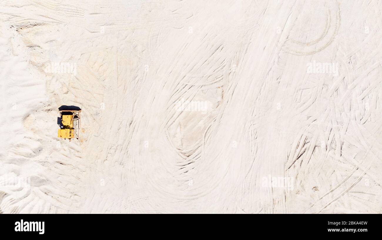 Yellow Bulldozer at Sand Quarry. Top Down Aerial Drone View. Geometric ...