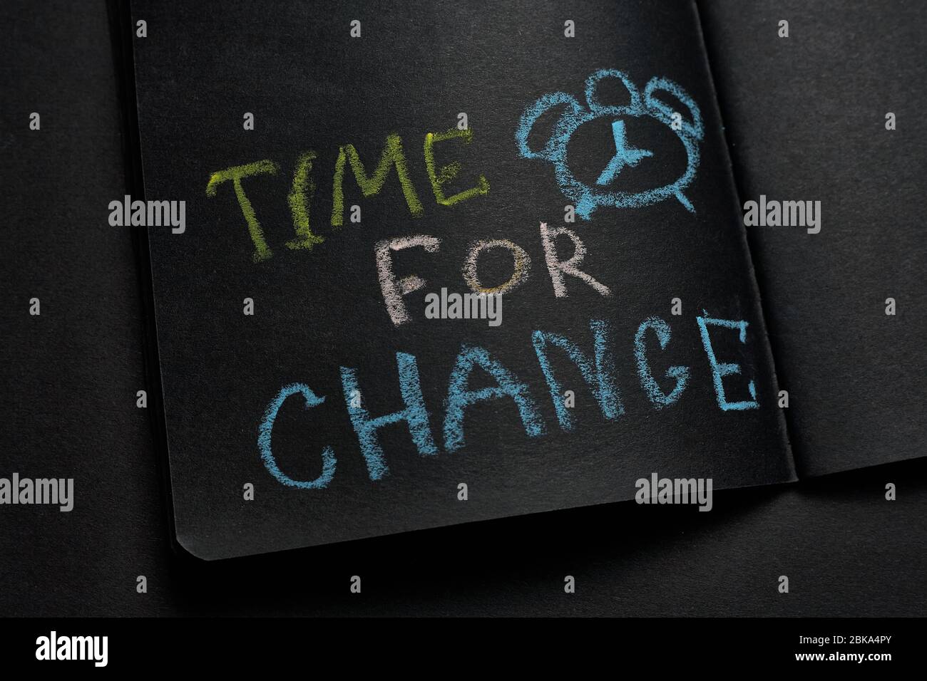Time for a change. Handwritten concept in a black notebook. Business ...