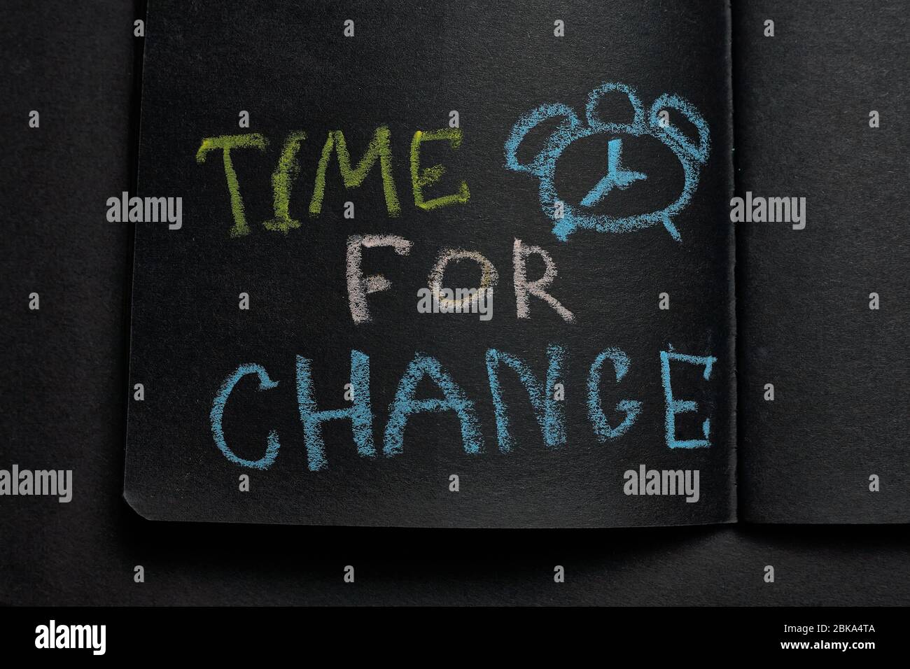 Time for a change. Handwritten concept in a black notebook. Business ...